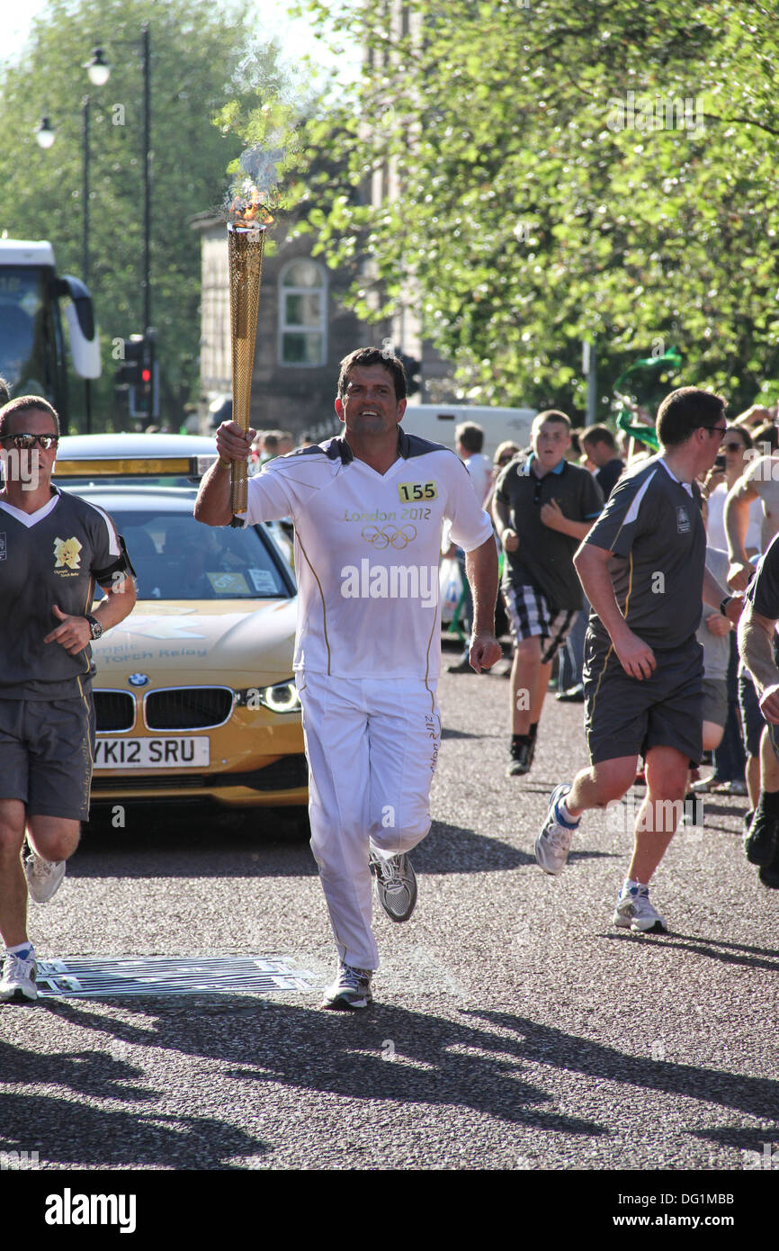 Man carries olympic torch Stock Photo - Alamy