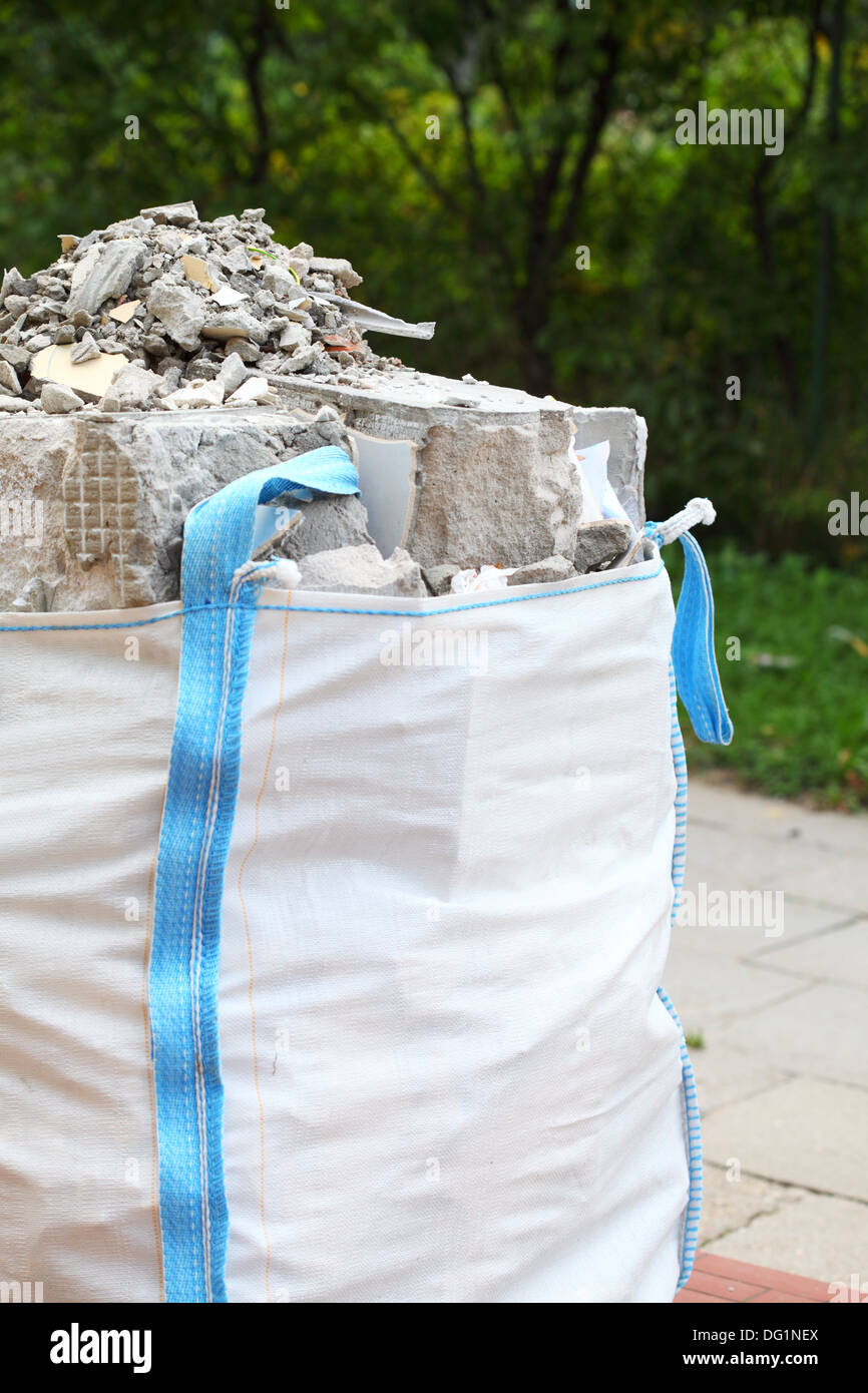 Full construction waste debris bags, garbage bricks, pile of rubble and ...