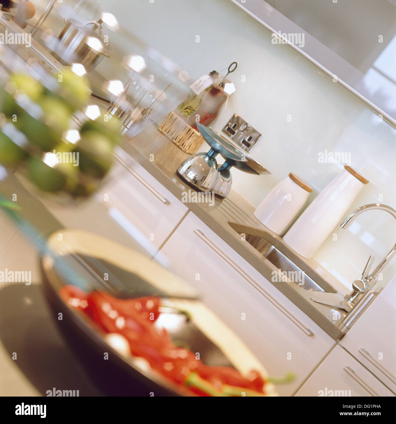 Angled view of kitchen scales on worktop beside stainless steel sink in ...