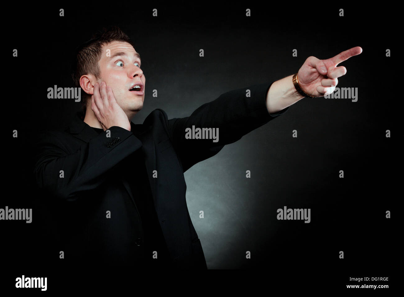 man pointing at something interesting showing your product black ...