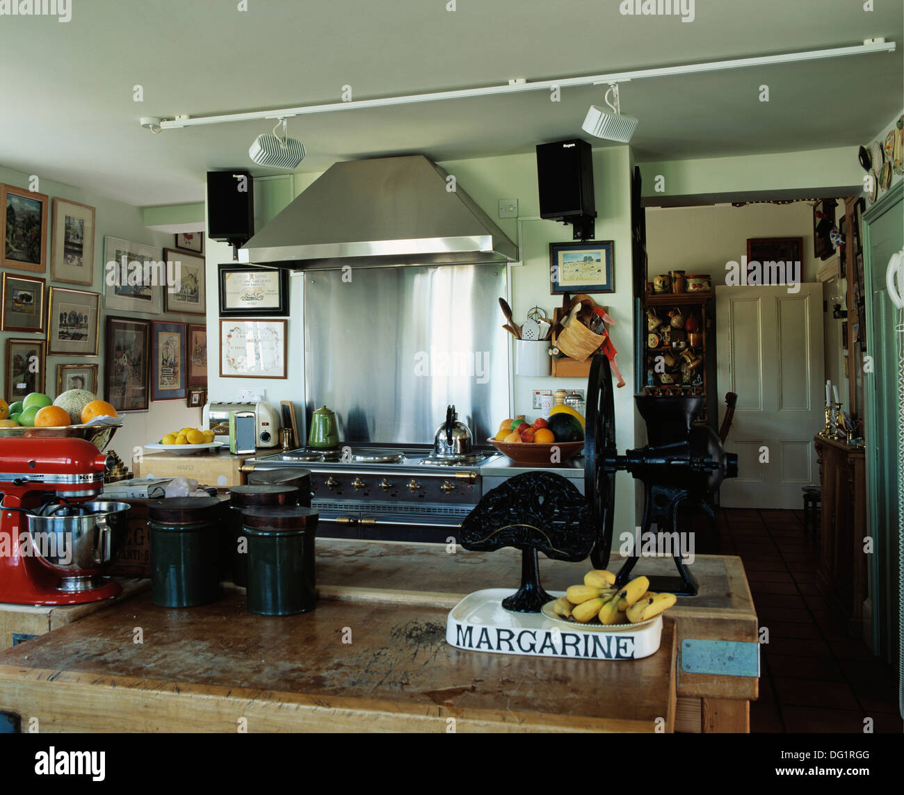 Stainless steel extractor above oven in country kitchen with black ...