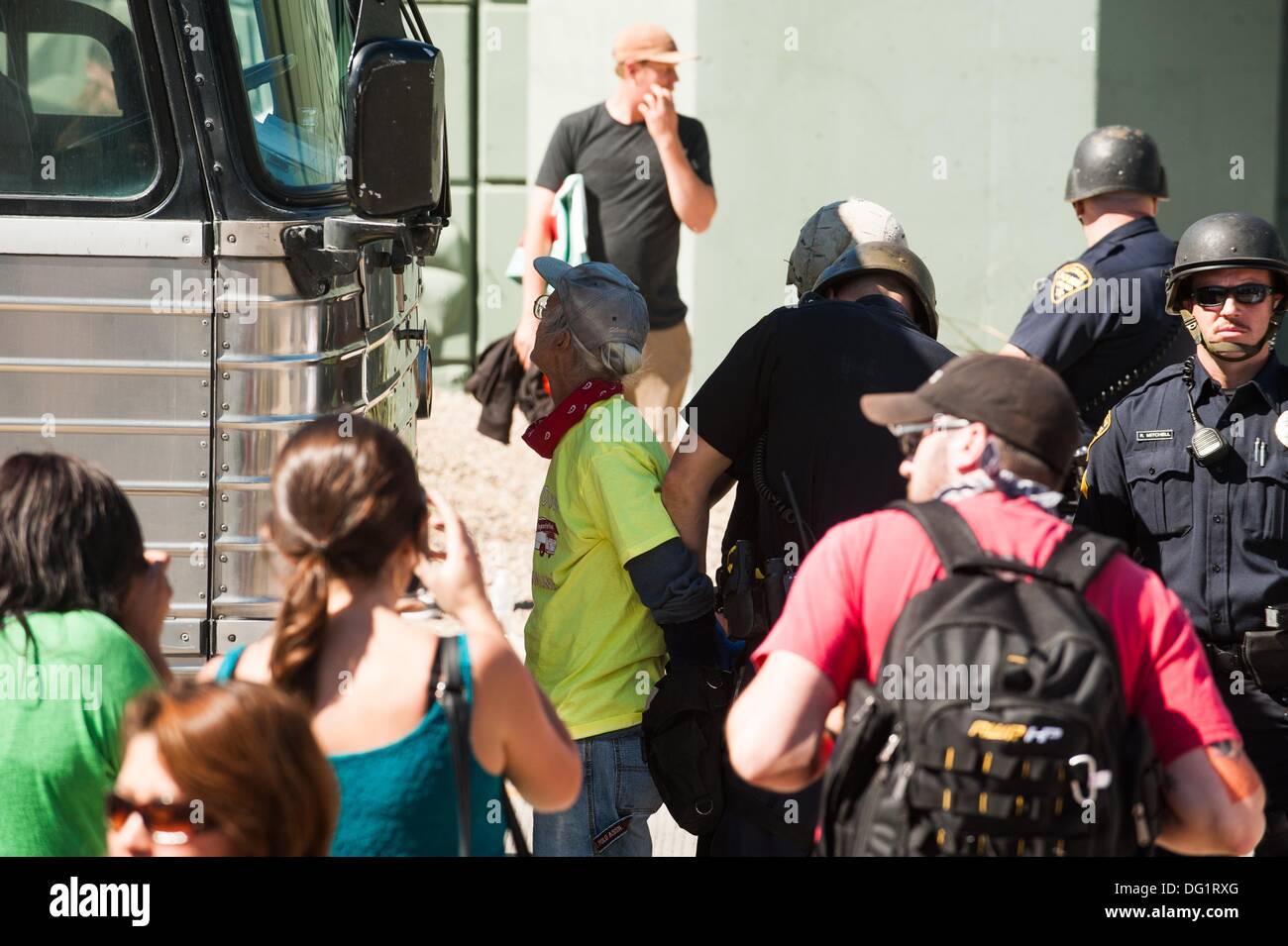 Tucson, Arizona, UK. 11th Oct, 2013. Approximately 20 protestors ...