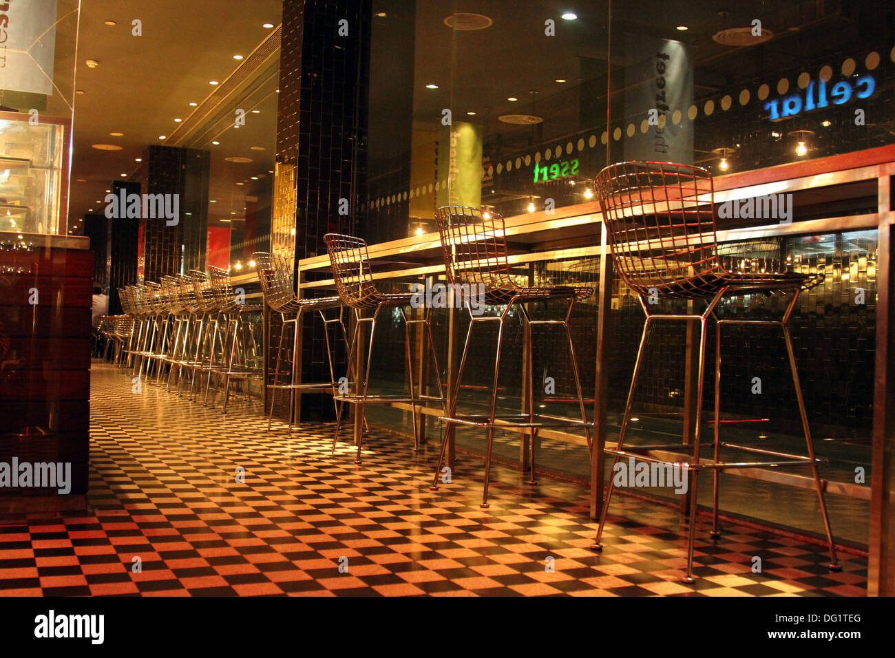 Chairs in row in bar Stock Photo - Alamy