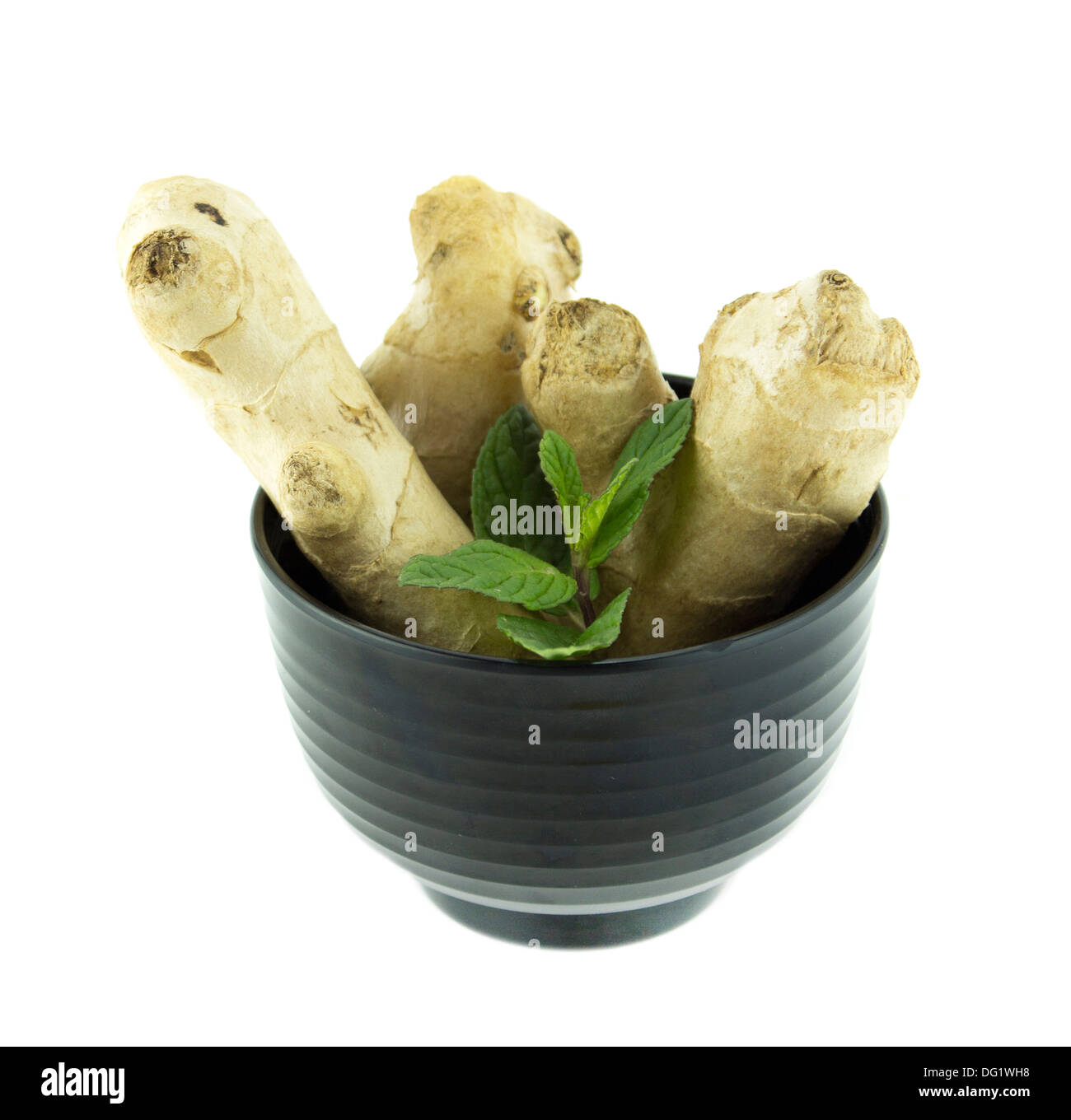 Fresh Ginger root in black bowl on a white background Stock Photo - Alamy