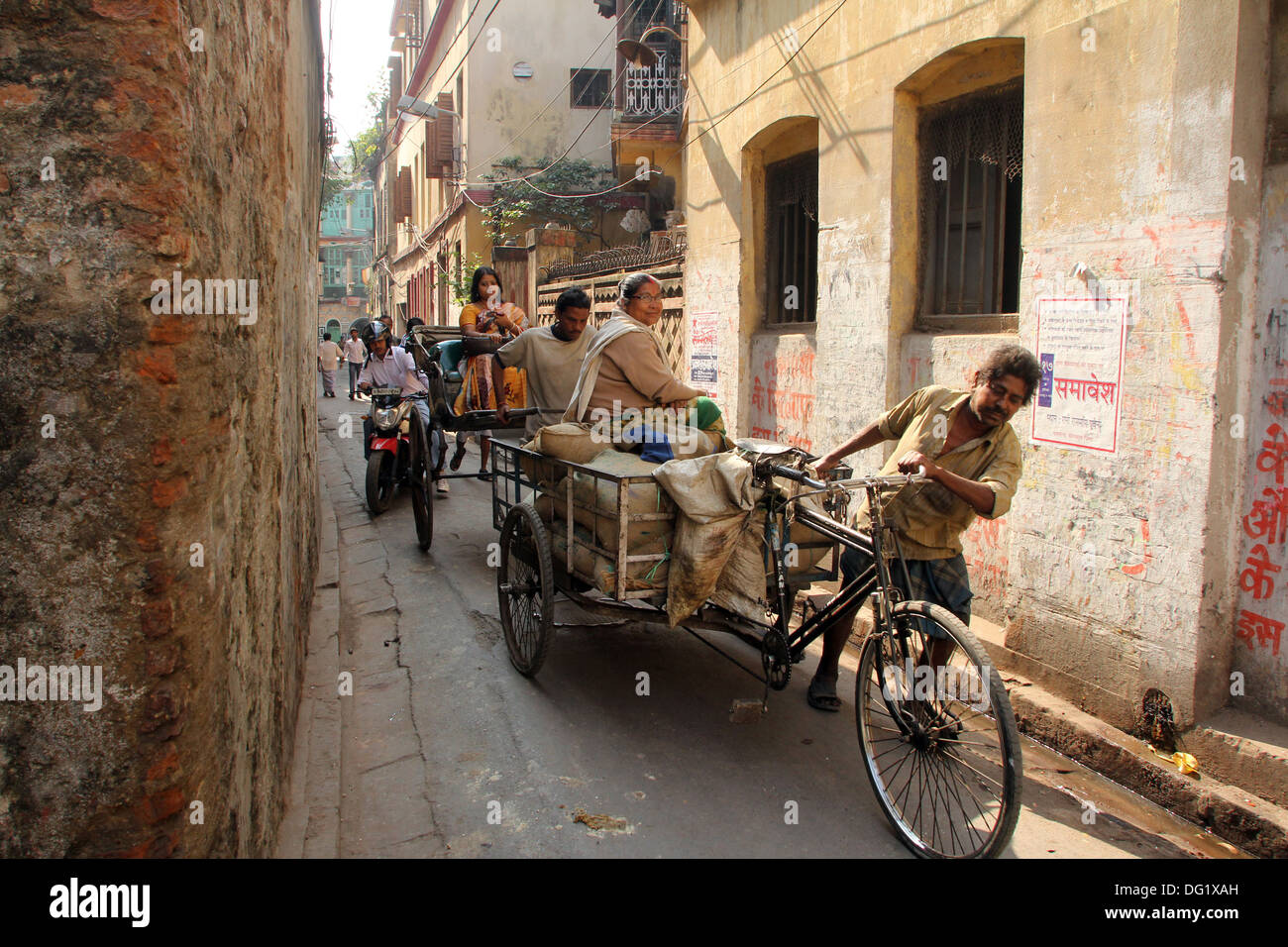 Rickshaw man pulls the customer in the streets on November 28, 2012 in ...