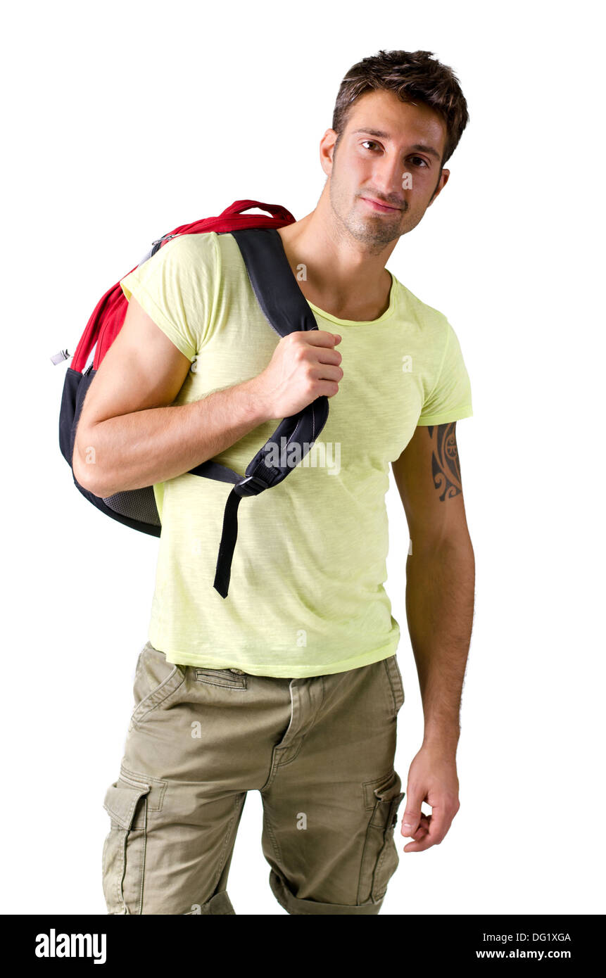 Attractive young man with backpack, isolated on white background ...