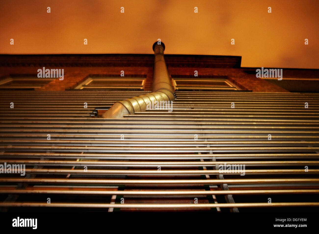 Metal Chimney Flue and Industrial Façade on Side of Building Against ...