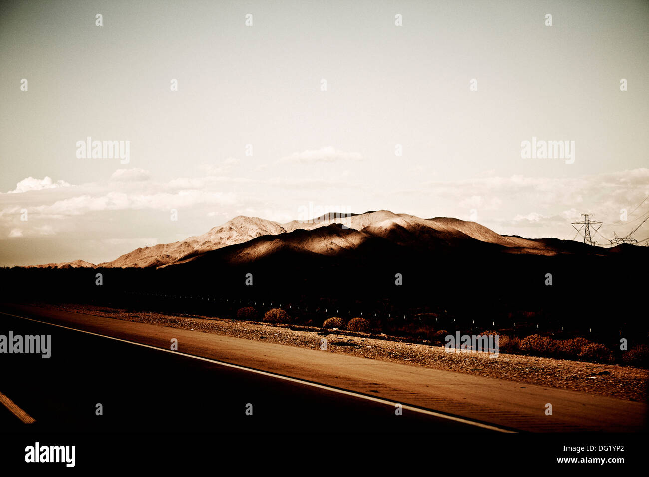 Shadow Covering Desert Mountains Near Highway, Nevada, USA Stock Photo ...