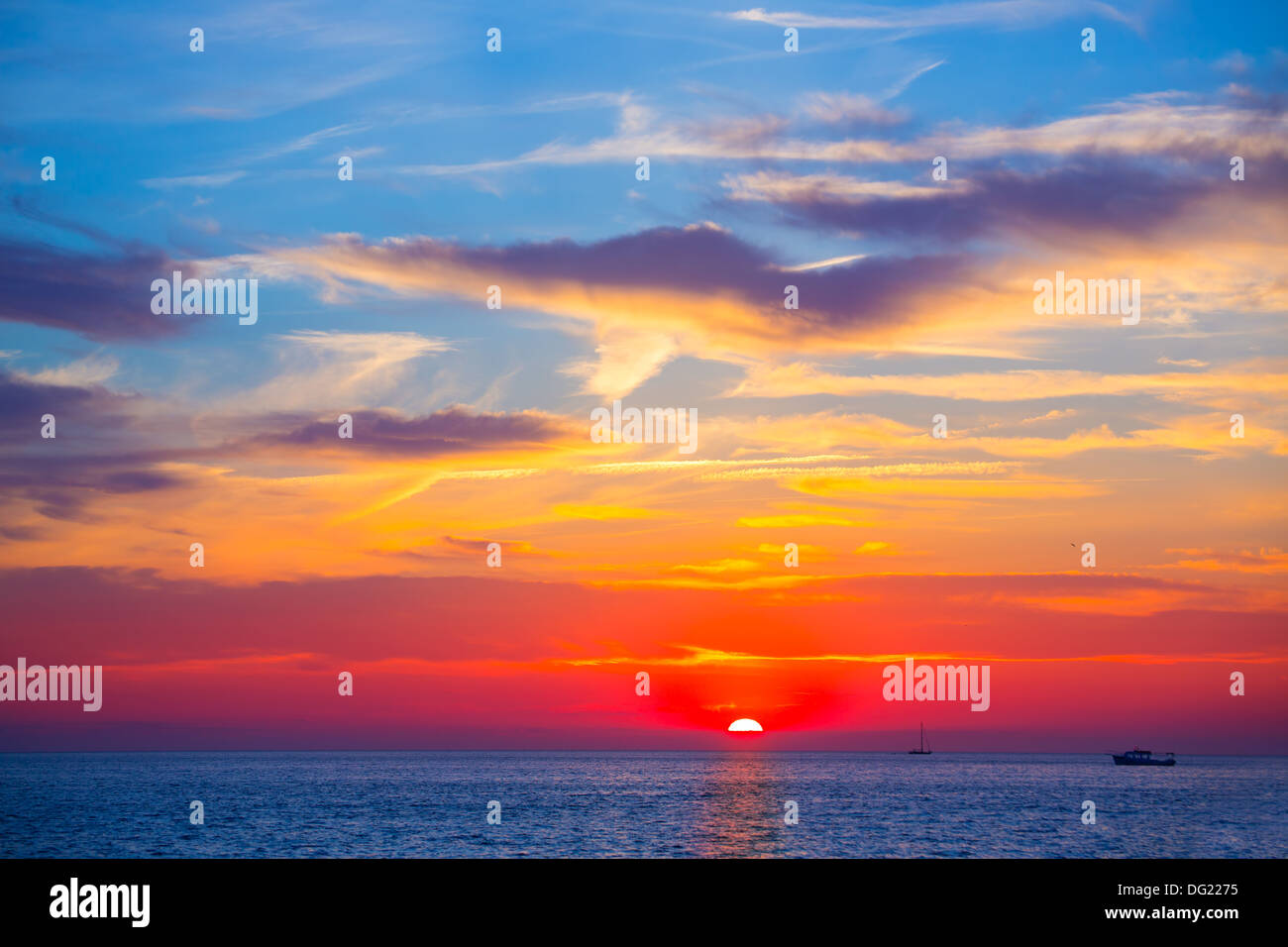 Ibiza San Antonio magic sunset red sky clouds in Balearic islands spain ...