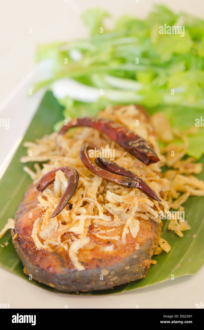 Fried pickled fish , onion and chili served with fresh vegetable on ...