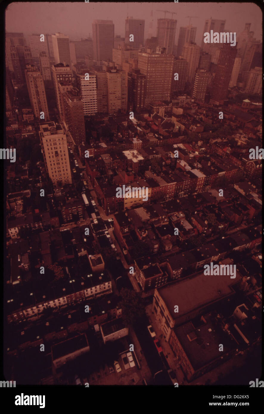 This image depicts a blend of row houses and skyscrapers in a central ...