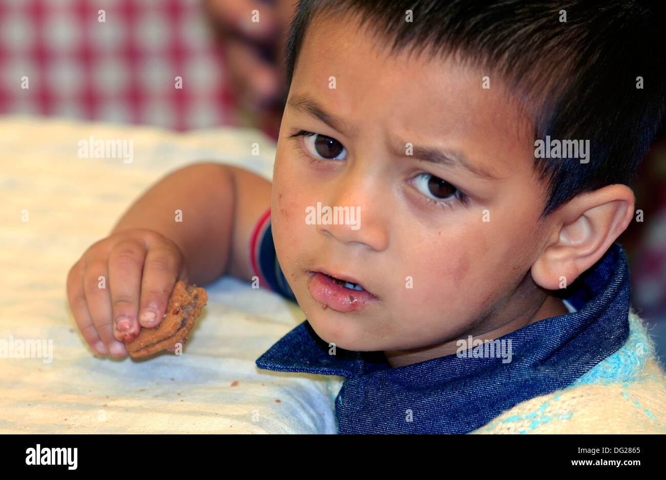 Indian boy eating biscuit hi-res stock photography and images - Alamy