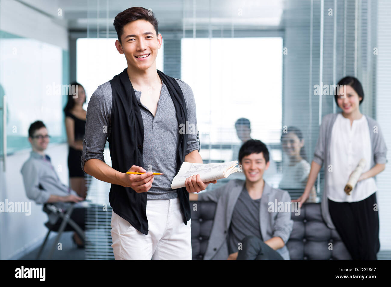 Happy office workers in the company Stock Photo - Alamy