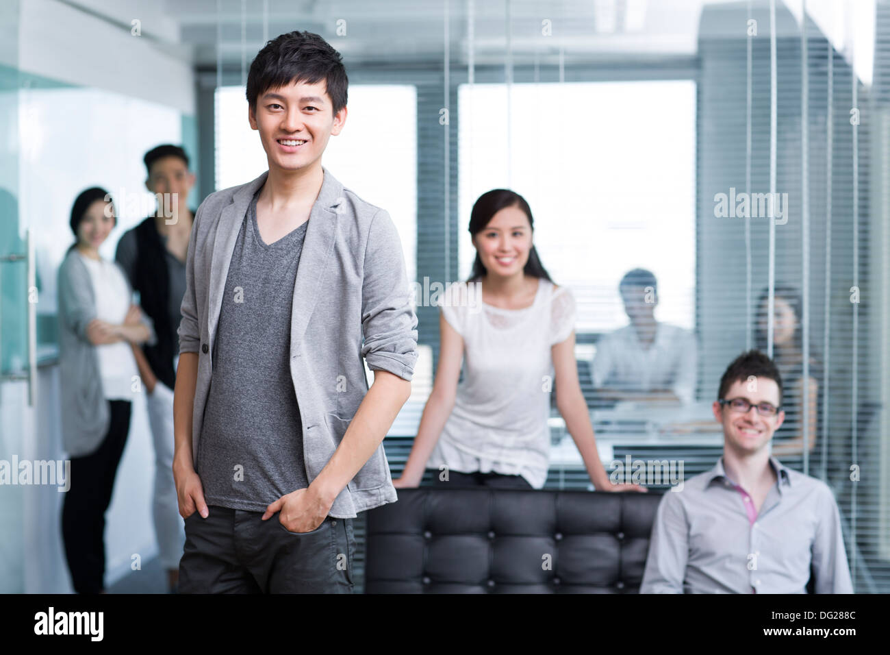 Happy office workers in the company Stock Photo - Alamy