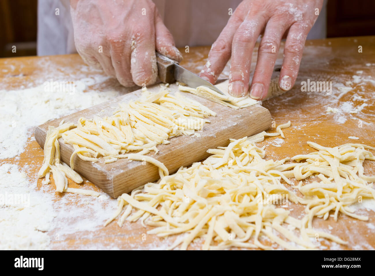 Person making noodles hi-res stock photography and images - Alamy