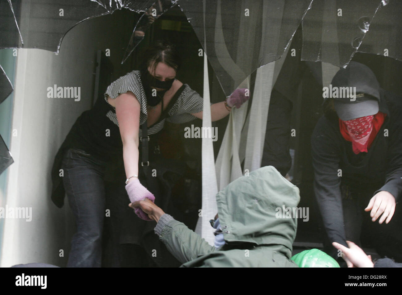 Protesters smashed the Royal Bank of Scotland (RBS) office windows ...