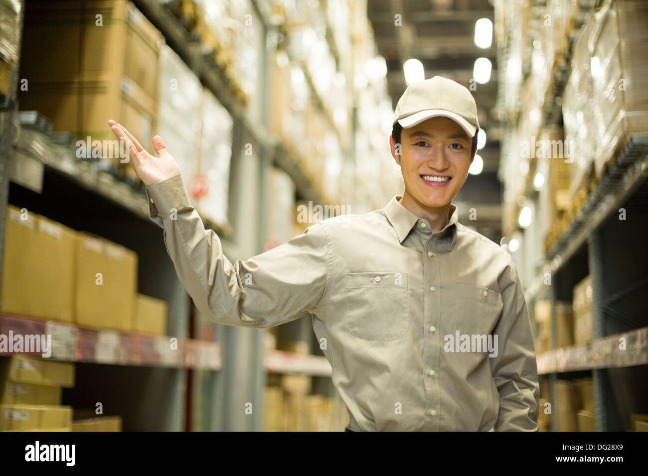 Young logistics staff in warehouse Stock Photo - Alamy