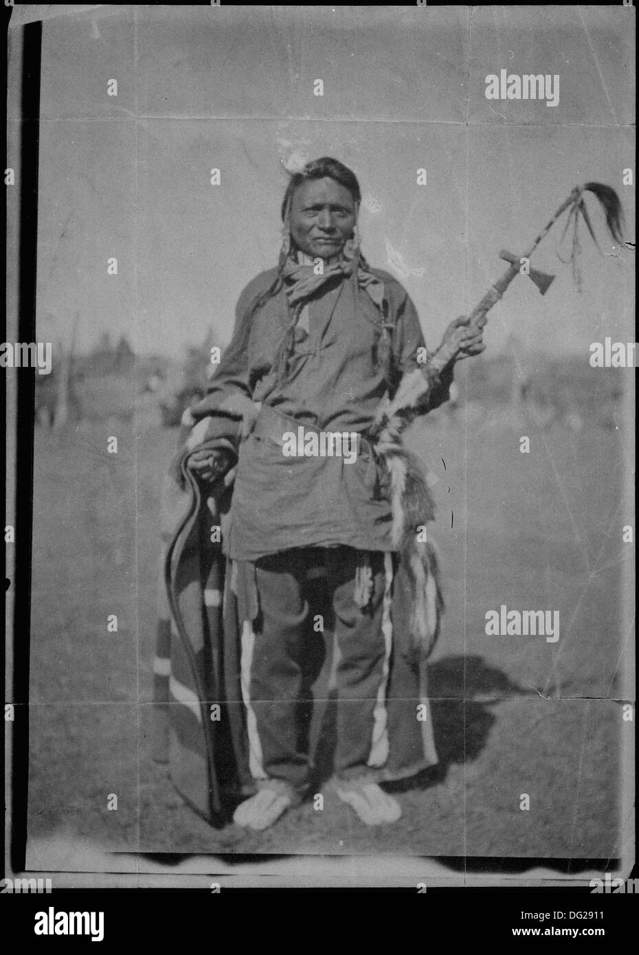 A portrait of an Indigenous American individual, capturing cultural and ...