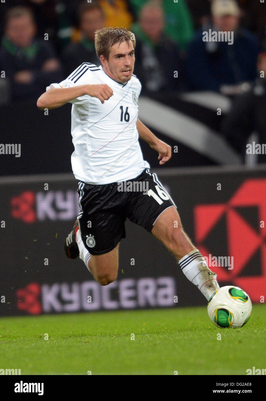 Cologne, Germany. 11th Oct, 2013. Germany's Philipp Lahm kicks the ball ...