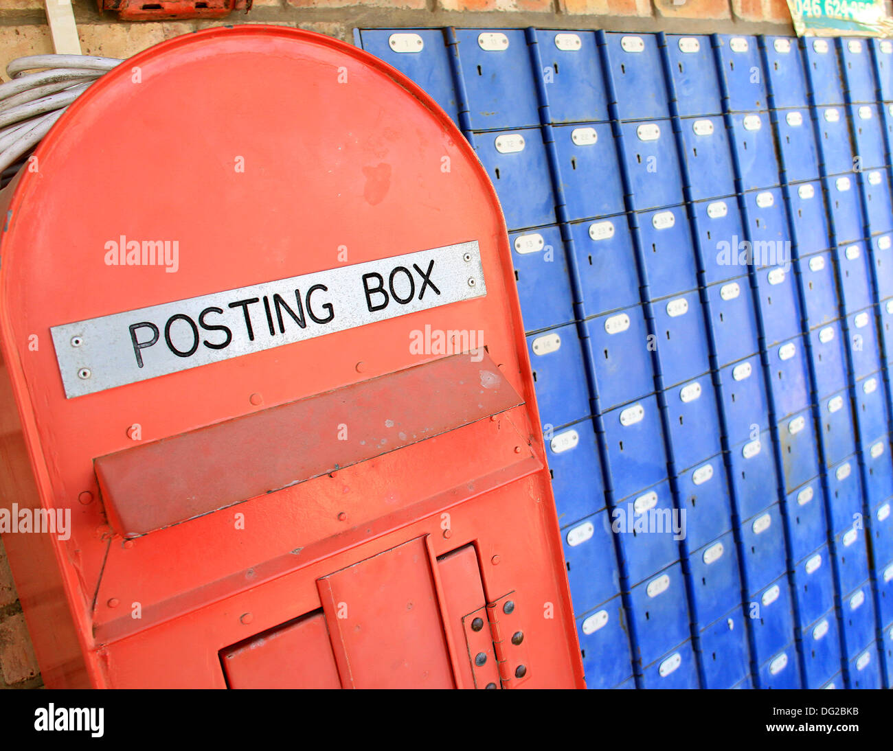 Close crop image of brightly coloured blue and red post boxes Stock ...