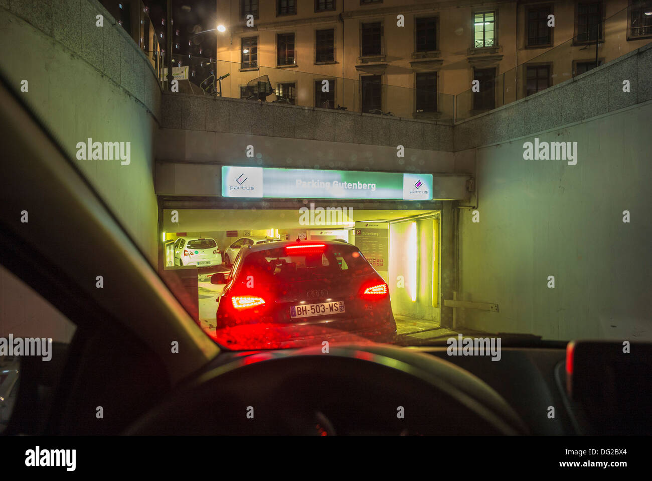 Car driving into underground parking lot at night Stock Photo - Alamy