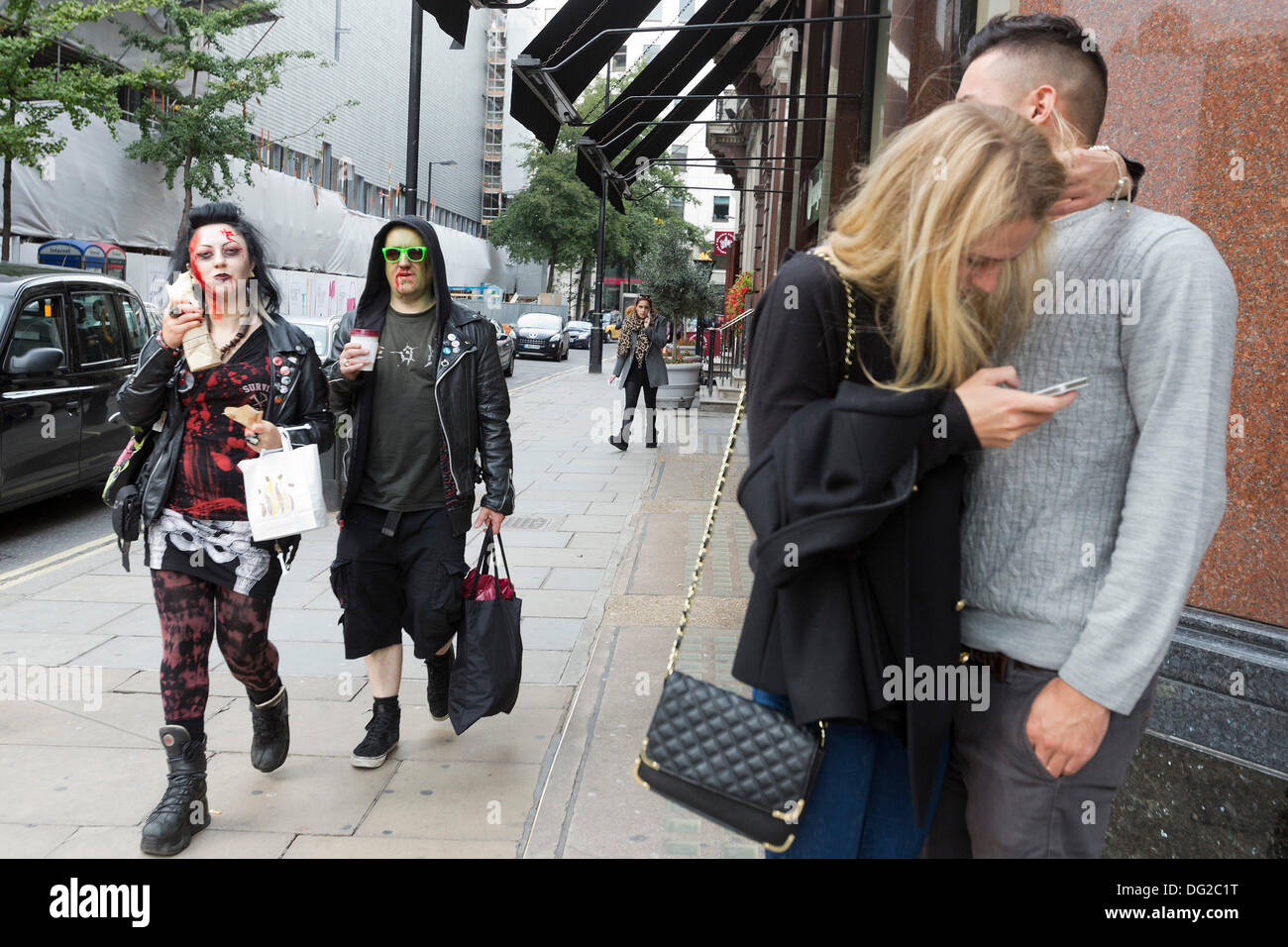 London, UK. 12 October 2013. Zombies in Oxford Street. World Zombie Day ...