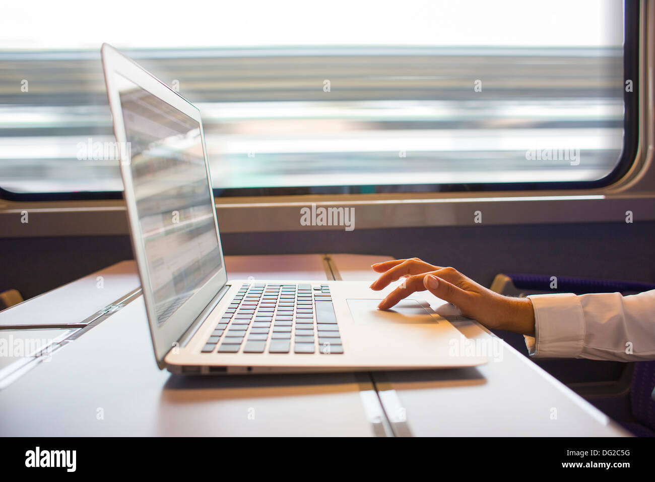 Female finger computer seating wagon Stock Photo - Alamy