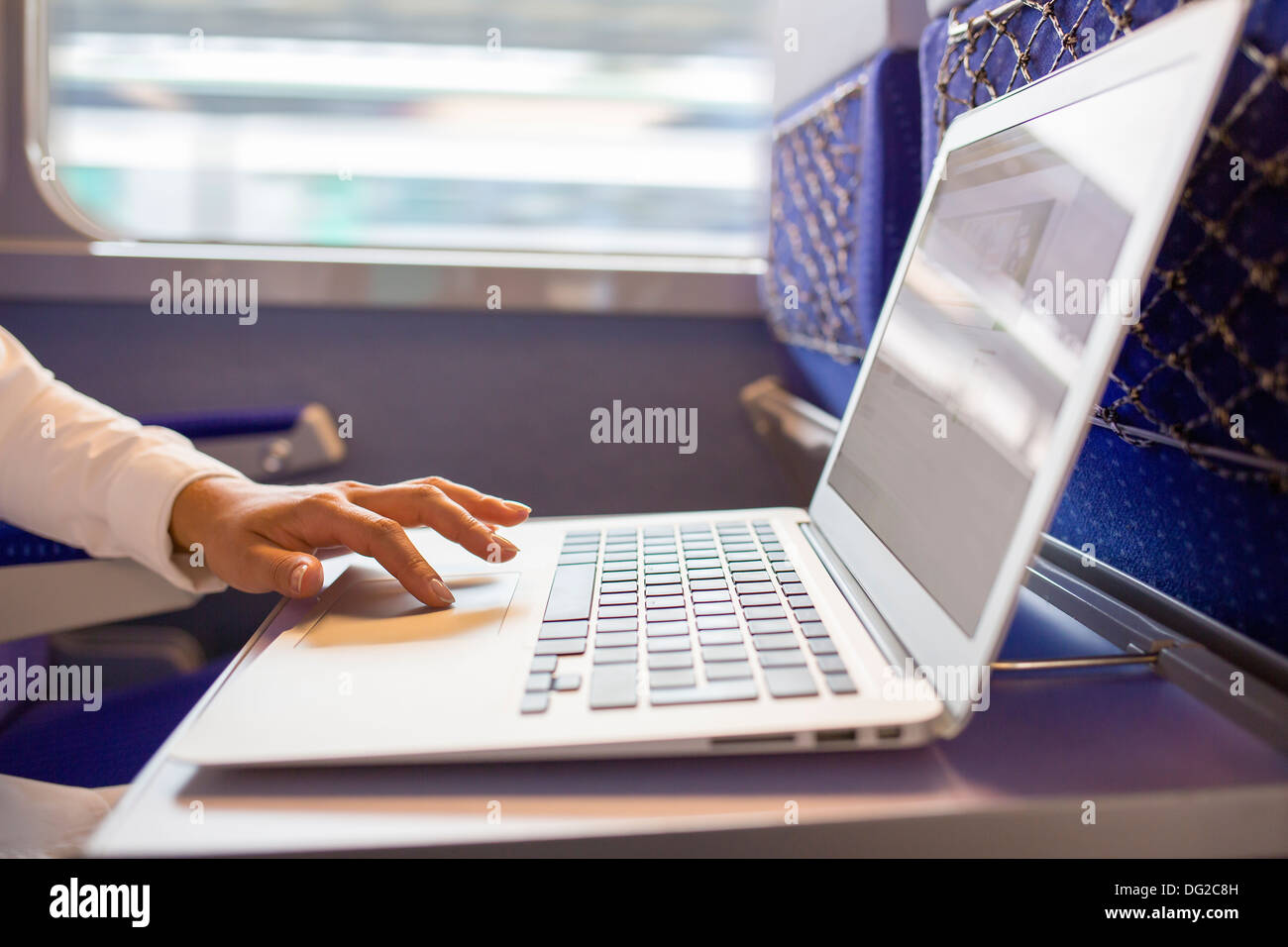 Female finger computer seating wagon Stock Photo - Alamy