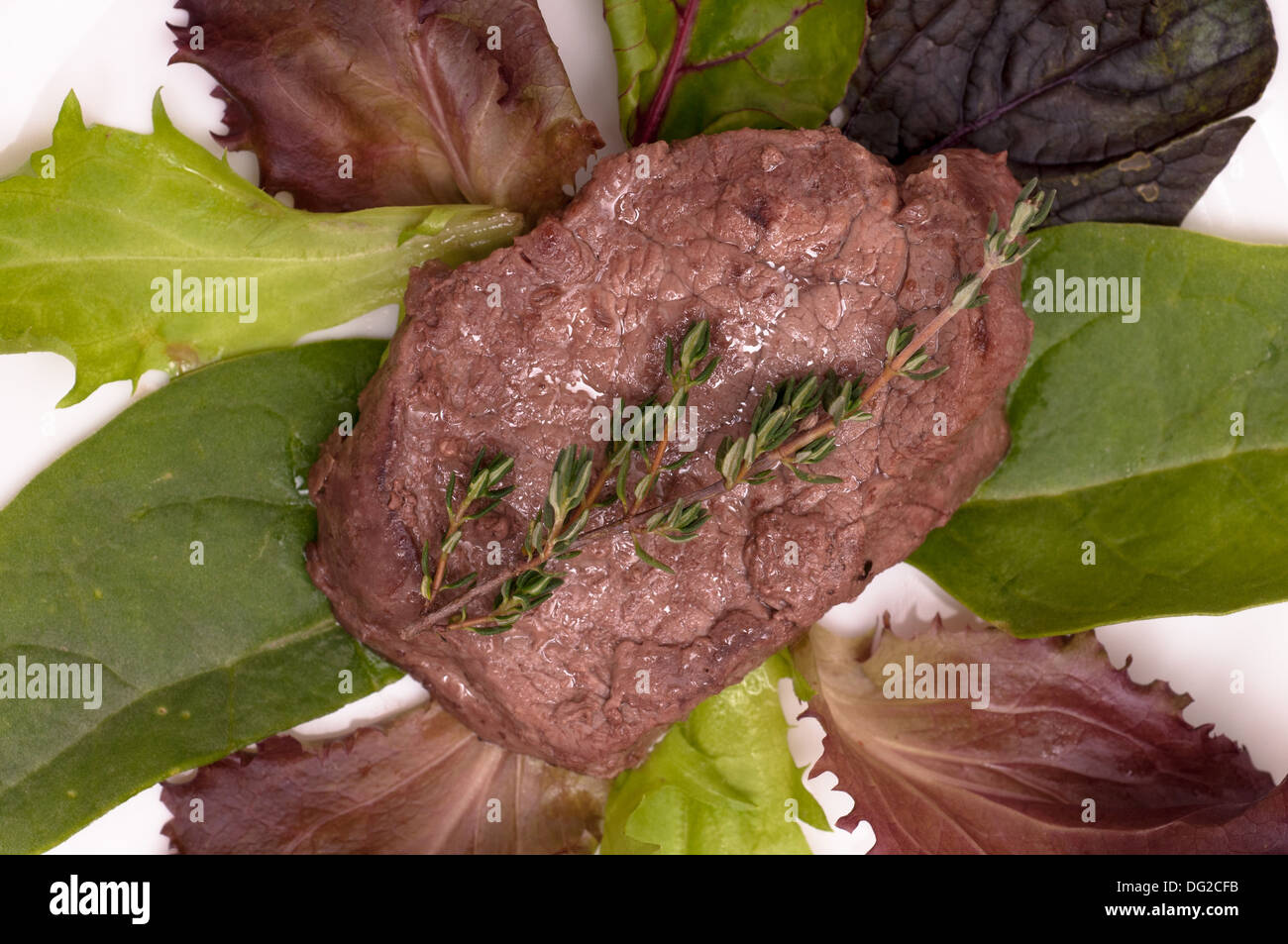 Roasted fillet of beef with thyme and leaf salad Stock Photo - Alamy