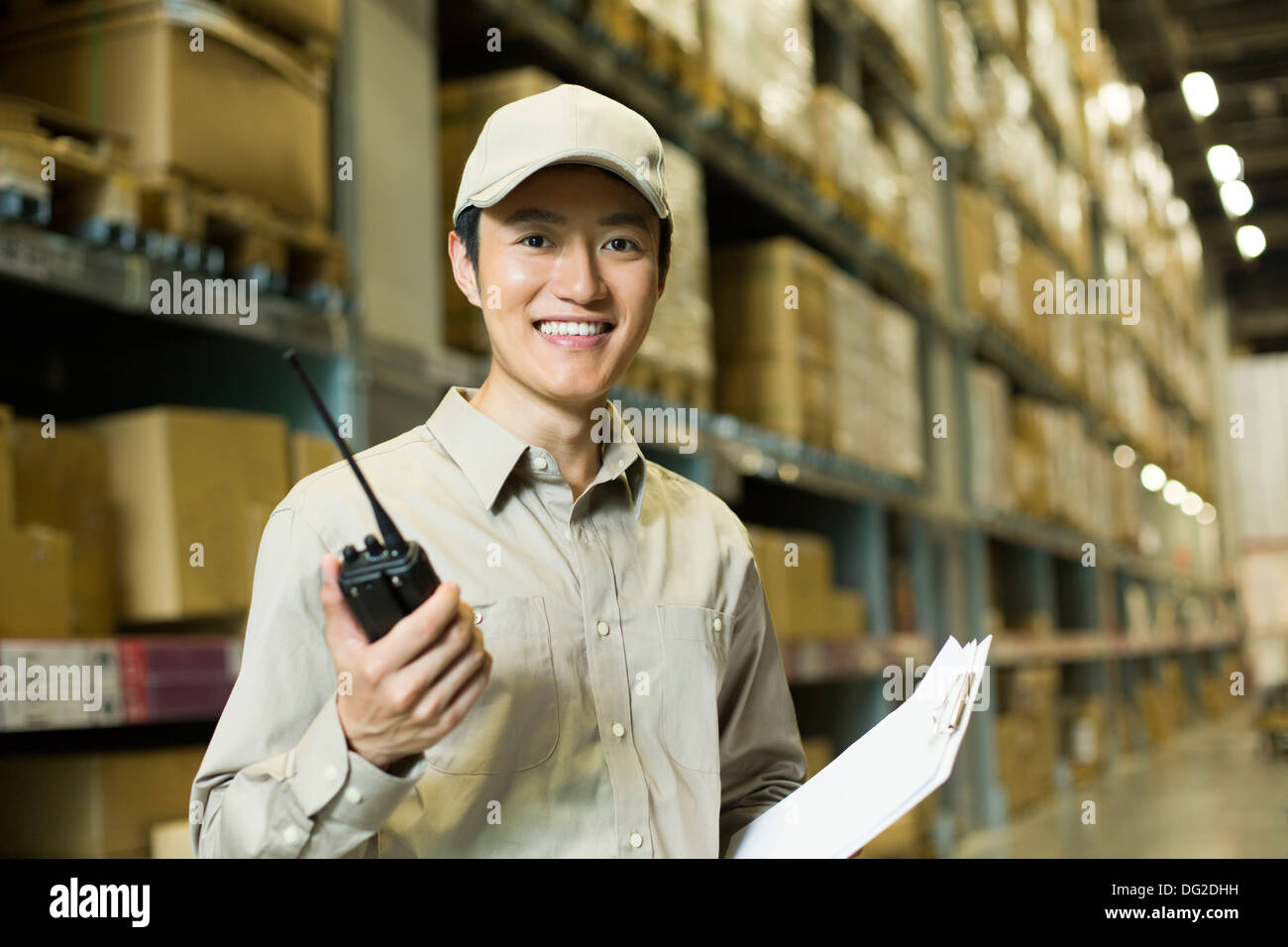 Young logistics staff in warehouse Stock Photo - Alamy