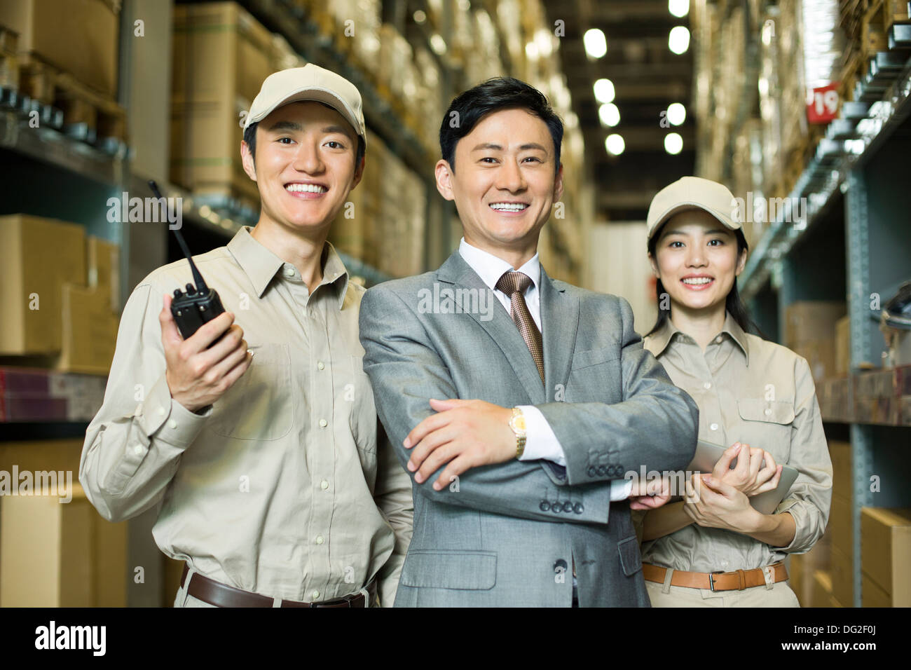 Young logistics team in warehouse Stock Photo - Alamy