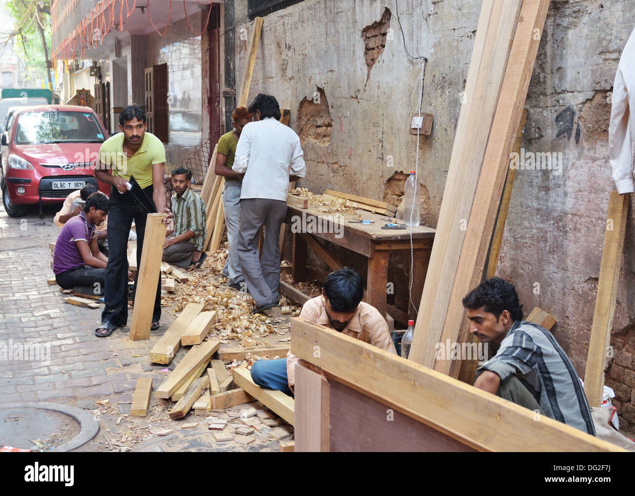 Carpenters working on street, Delhi, India Stock Photo - Alamy