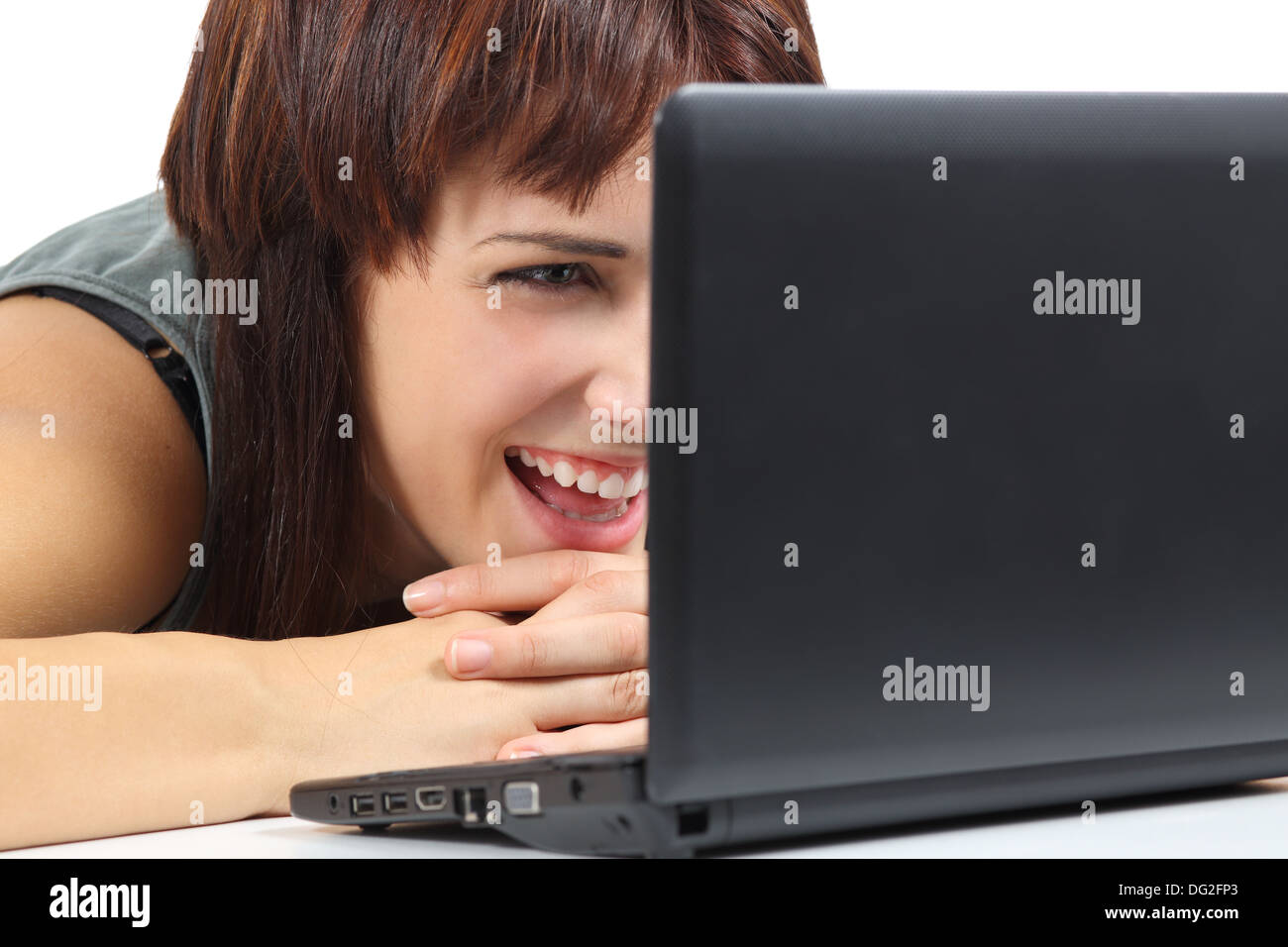 Beautiful woman laughing and watching a netbook computer isolated on a ...