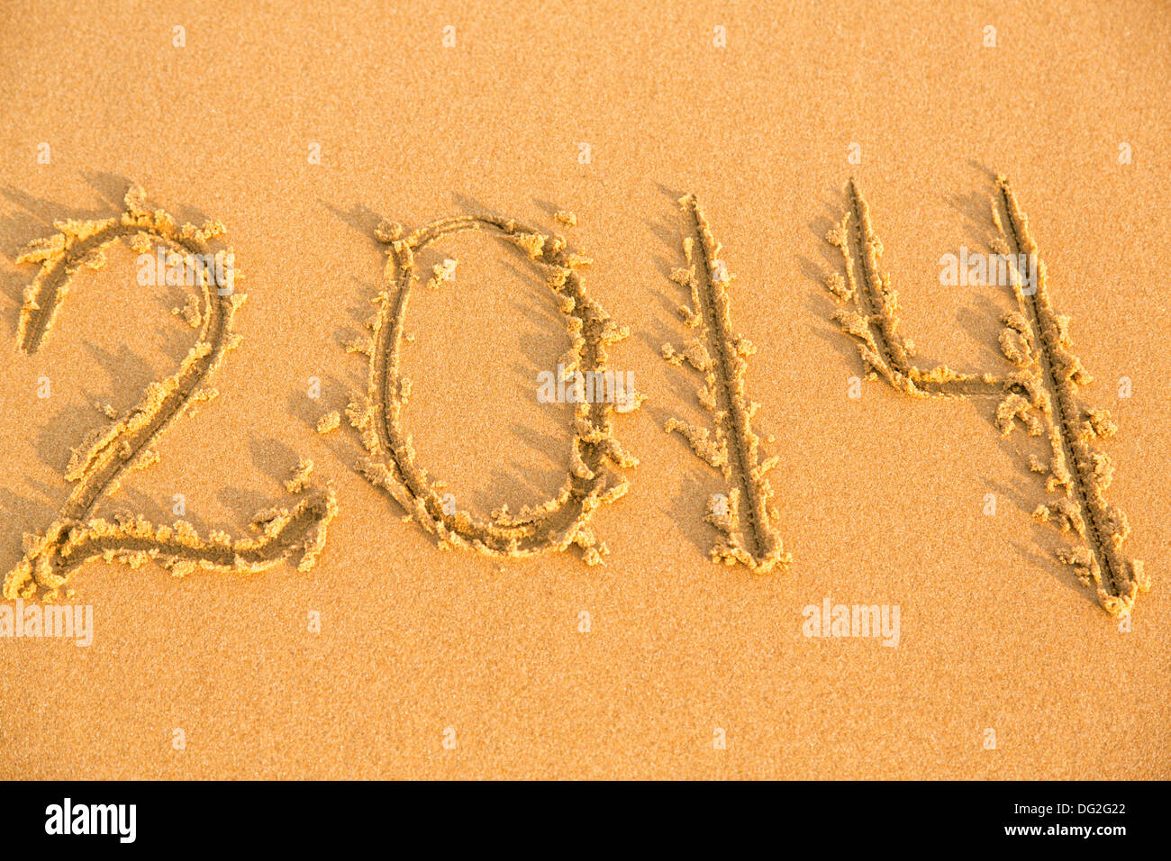 2014 numbers on the yellow sandy beach, text Stock Photo - Alamy