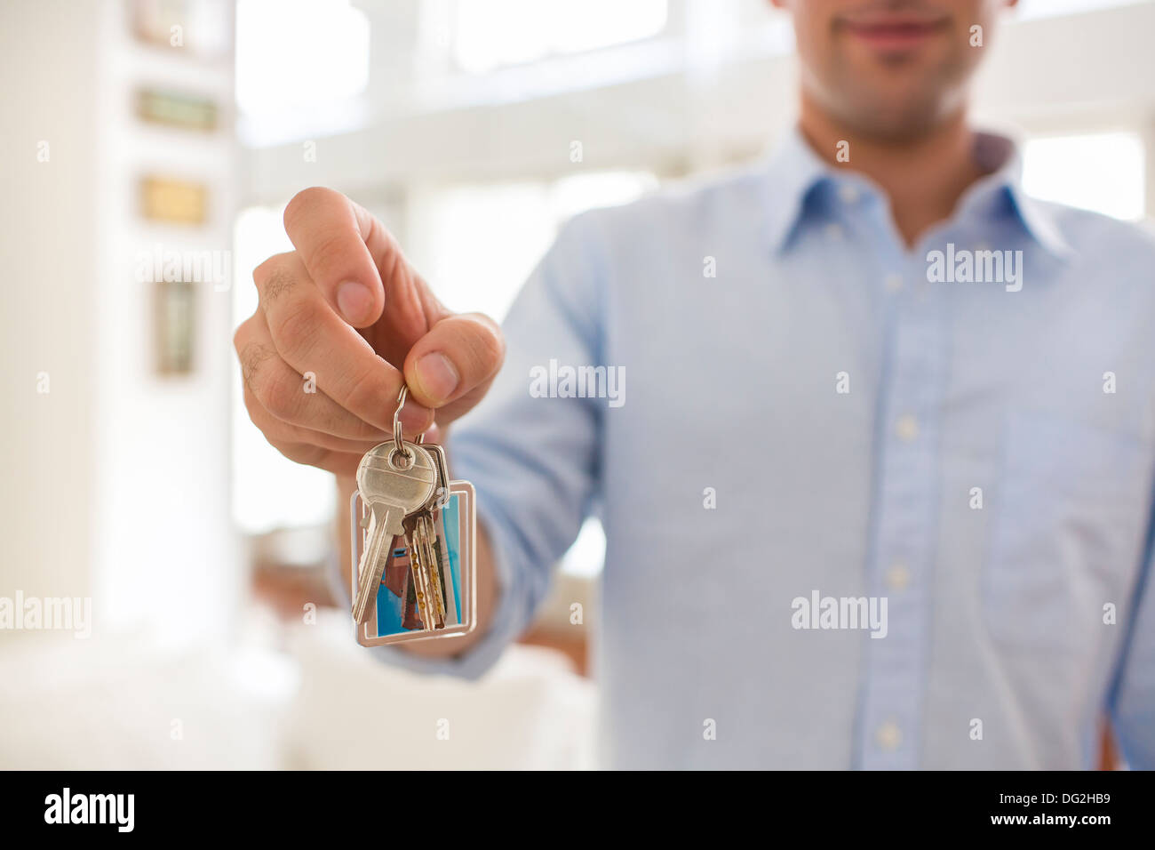 male at home keys smiling hand Stock Photo - Alamy