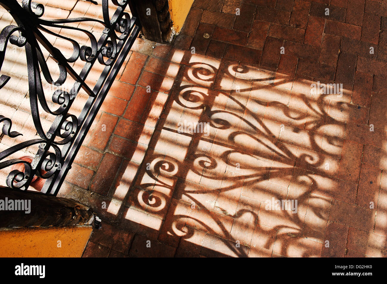 Shadow of a metal gate Stock Photo - Alamy