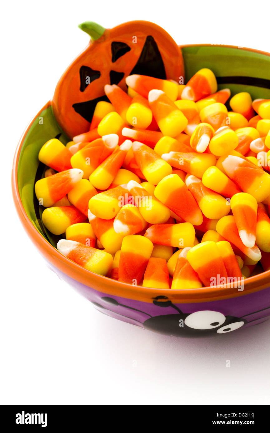 Candy corn cadnies in Halloween bowl on a white background Stock Photo ...