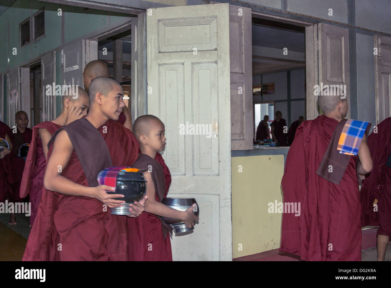Tall and small monks headed to the dining hall with their midday meal ...