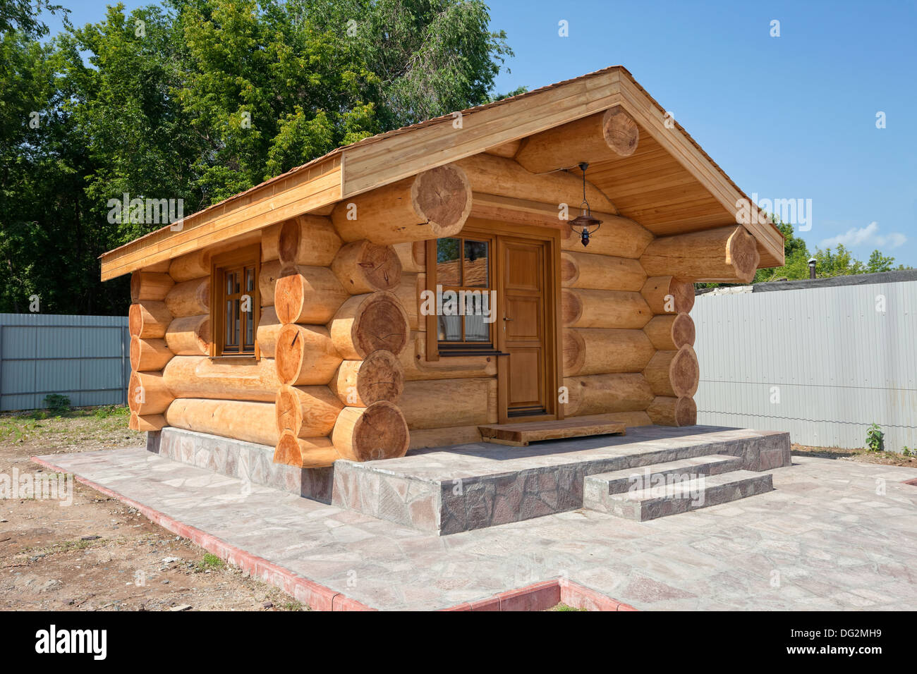 New wooden house made of logs in summertime Stock Photo - Alamy