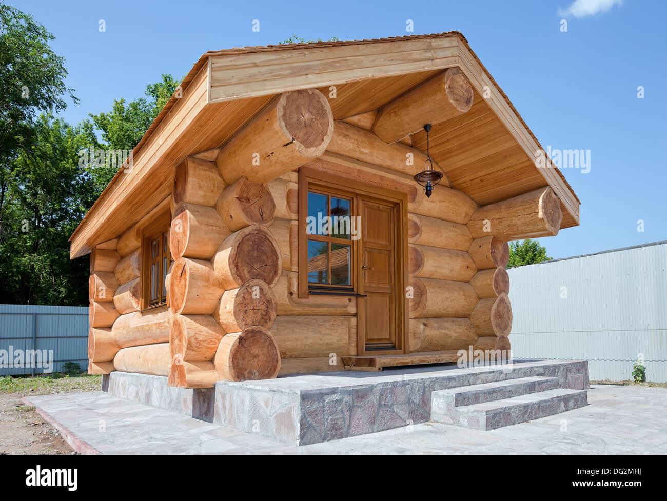 New wooden house made of logs in summertime Stock Photo - Alamy