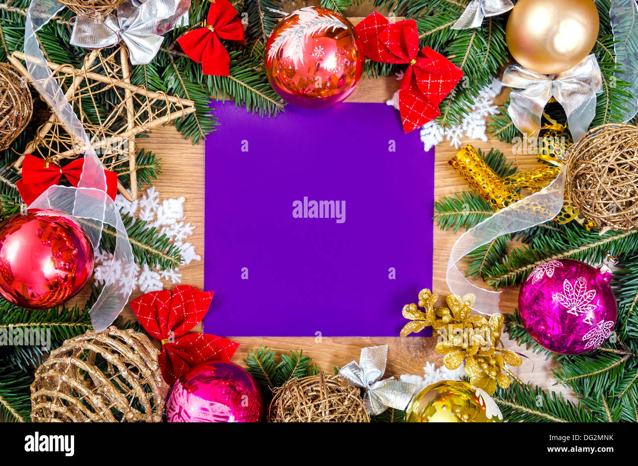 Christmas frame for congratulations and purple paper Stock Photo - Alamy