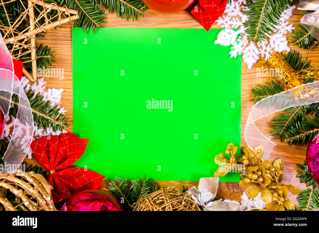 Christmas frame for congratulations and green paper Stock Photo - Alamy