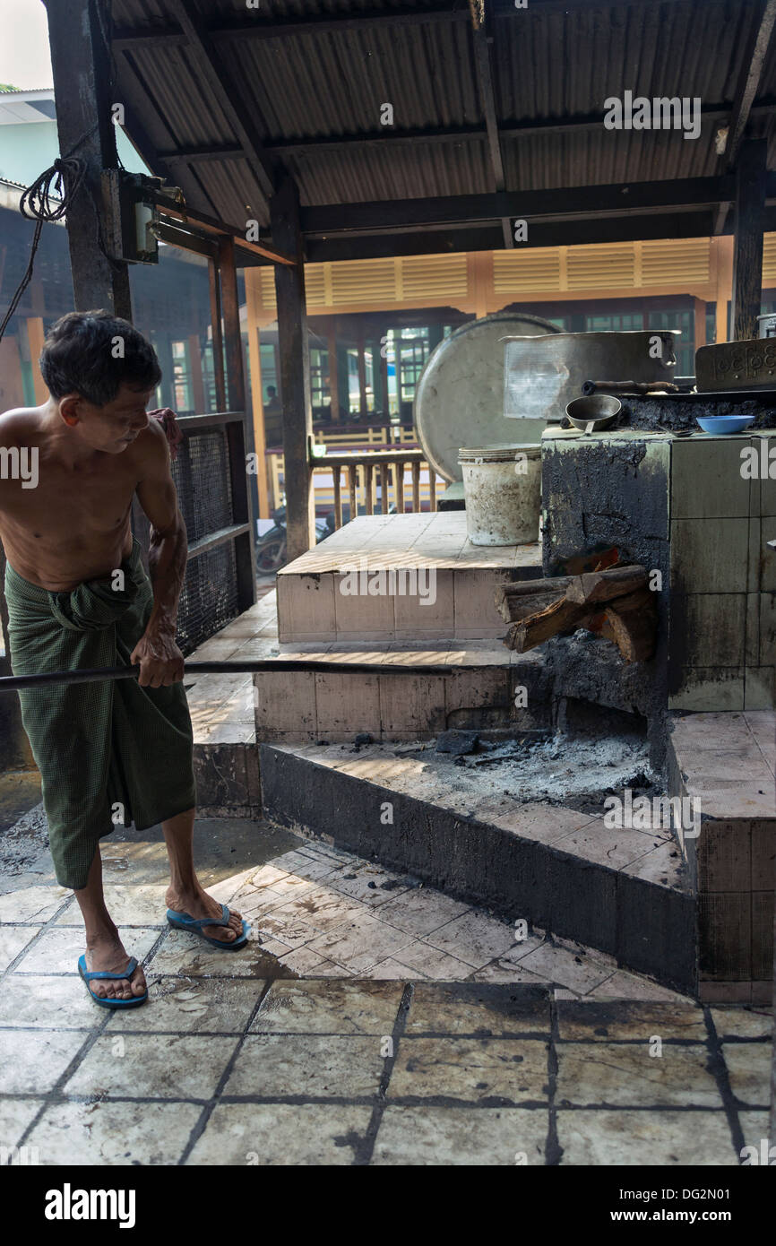 Man stoking fire hi-res stock photography and images - Alamy