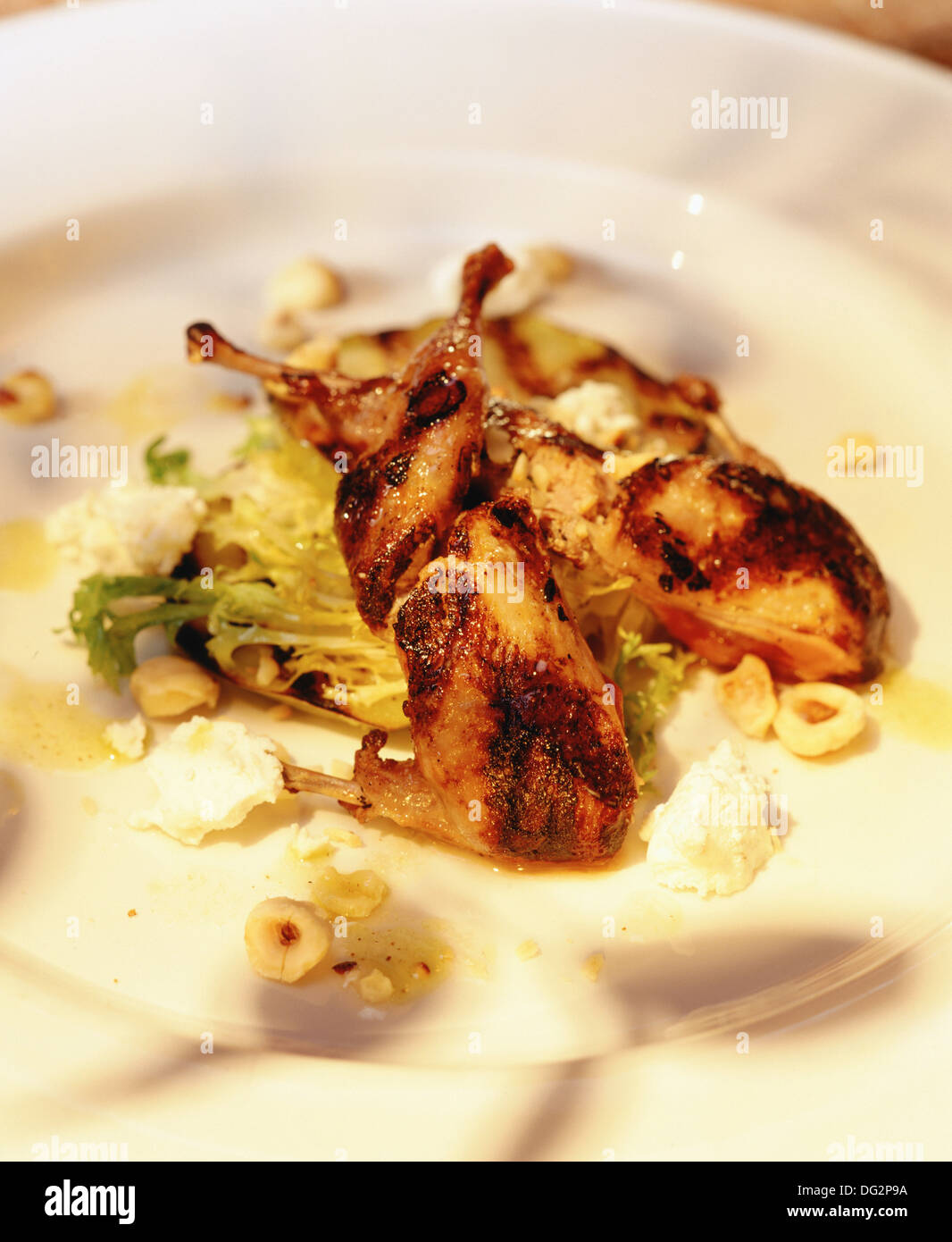 Grilled honey marinated quail Stock Photo - Alamy