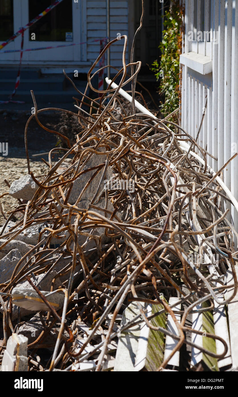 A pile of twisted salvaged scrap metal on a building construction site ...
