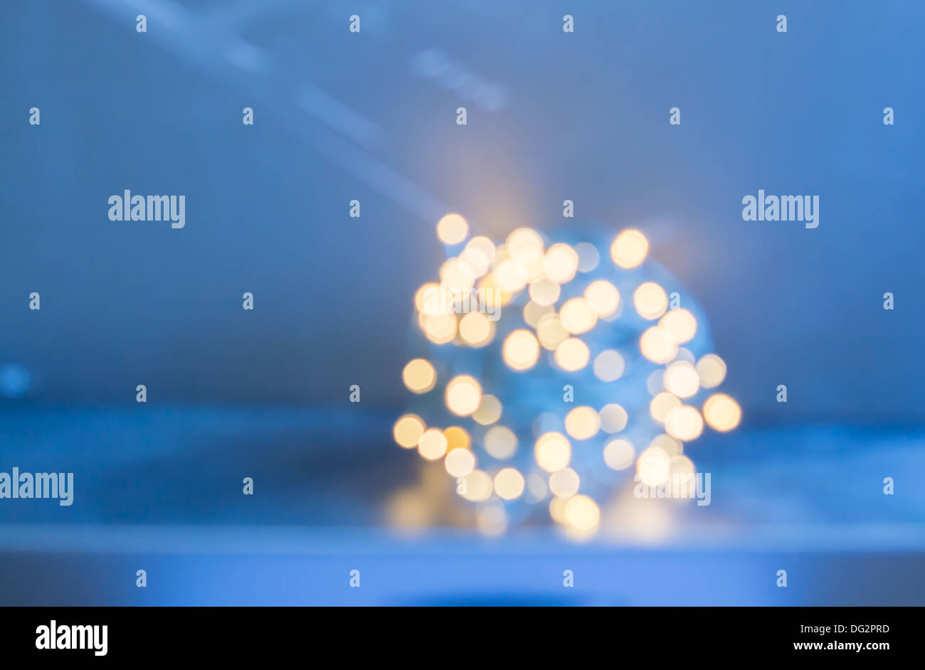 Gleaming lights on blue background blur with copy space Stock Photo - Alamy