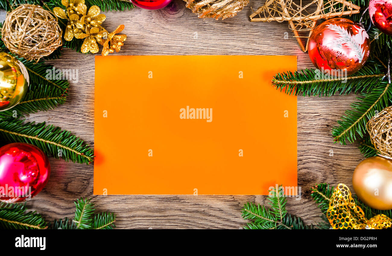 Christmas frame for congratulations and orange paper Stock Photo - Alamy