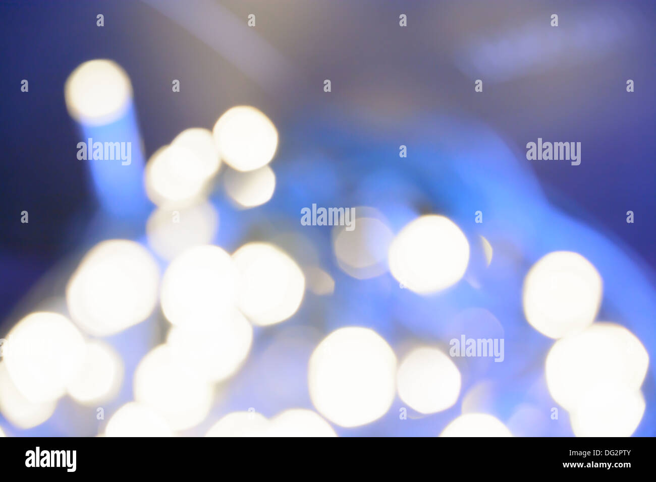 Lights gleaming in the dark winter night blur background Stock Photo ...