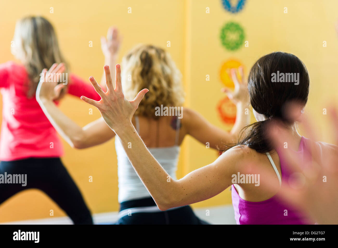 Three Women in Yoga Class, Rear View Stock Photo - Alamy