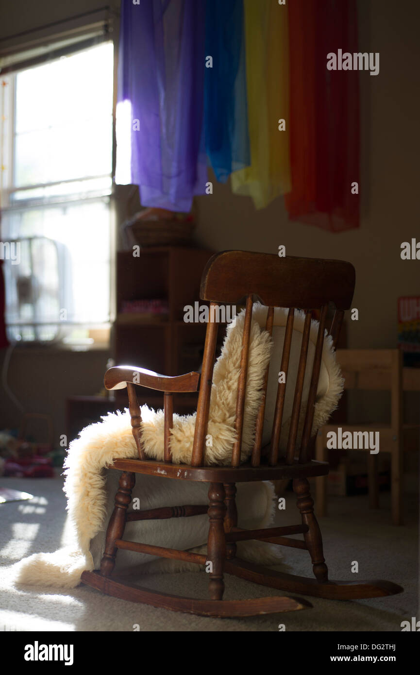 Rocking Chair with Lamb's Wool Covering in Child's Bedroom Stock Photo ...